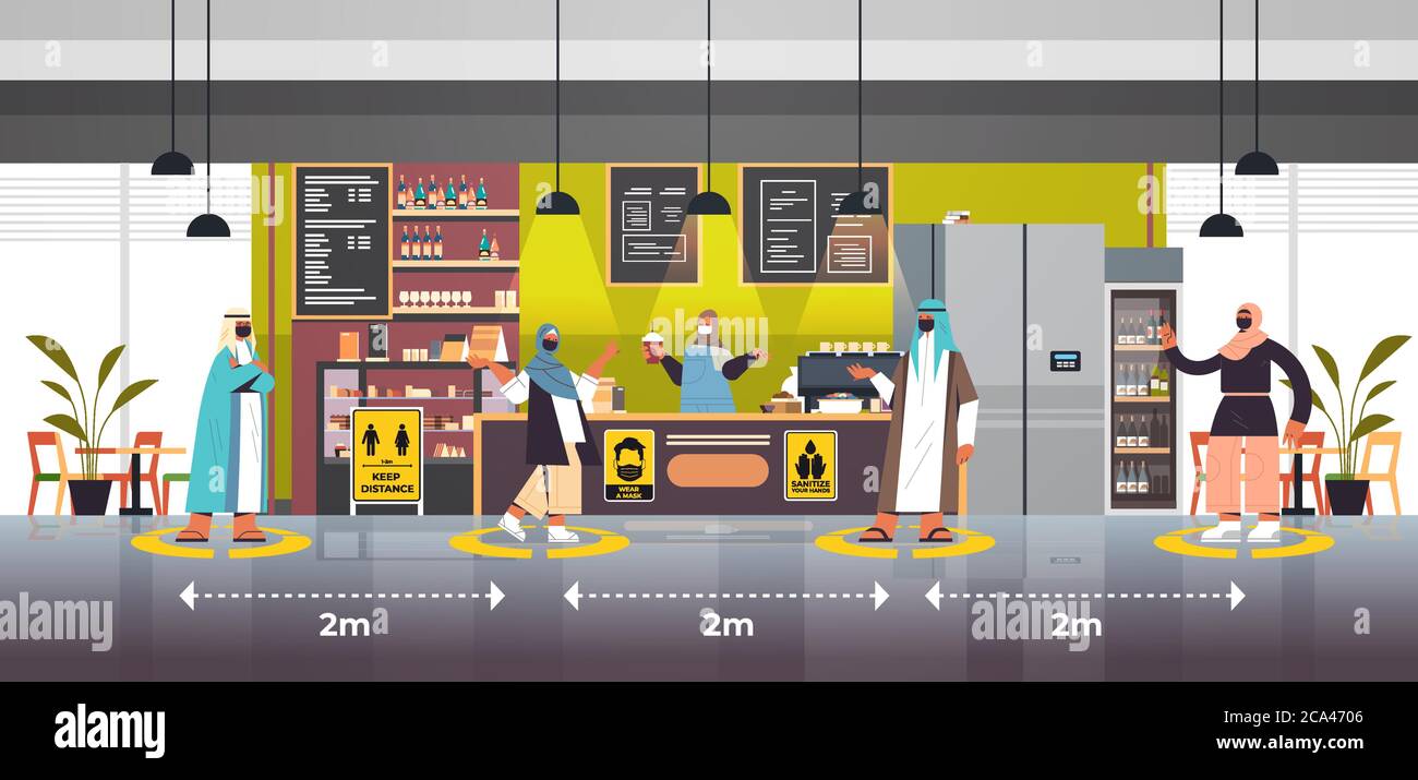 arabian cafe visitors in protective masks keeping distance to prevent ...