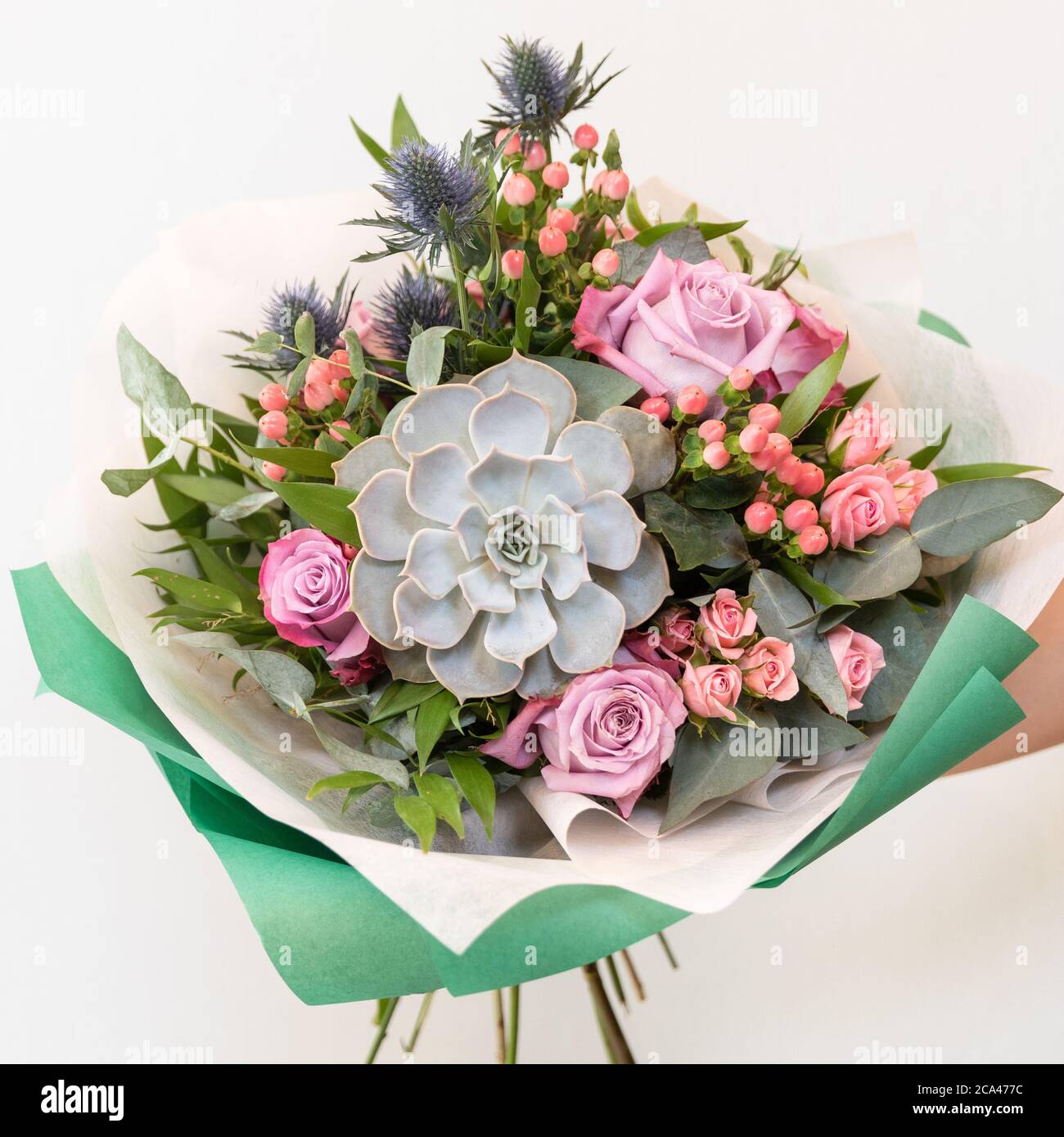 Beautiful woman holding gerbera hi-res stock photography and images - Alamy