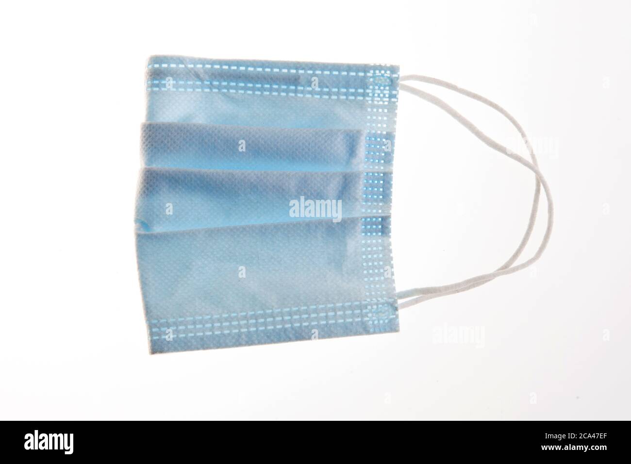 One blue face protection medical mask isolated on white background ...