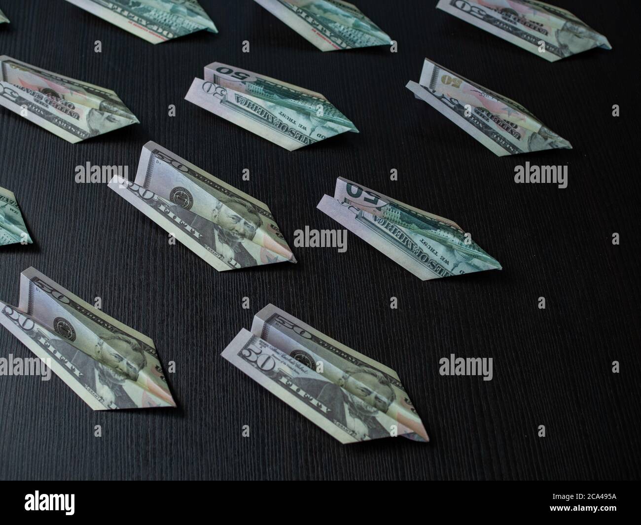 Paper planes made of dollar bills, usd cash flow concept. Inflation and ...