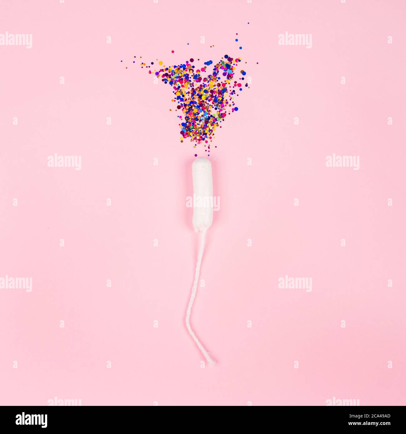 Square composition with clean cotton tampon and colorful sparkles on ...