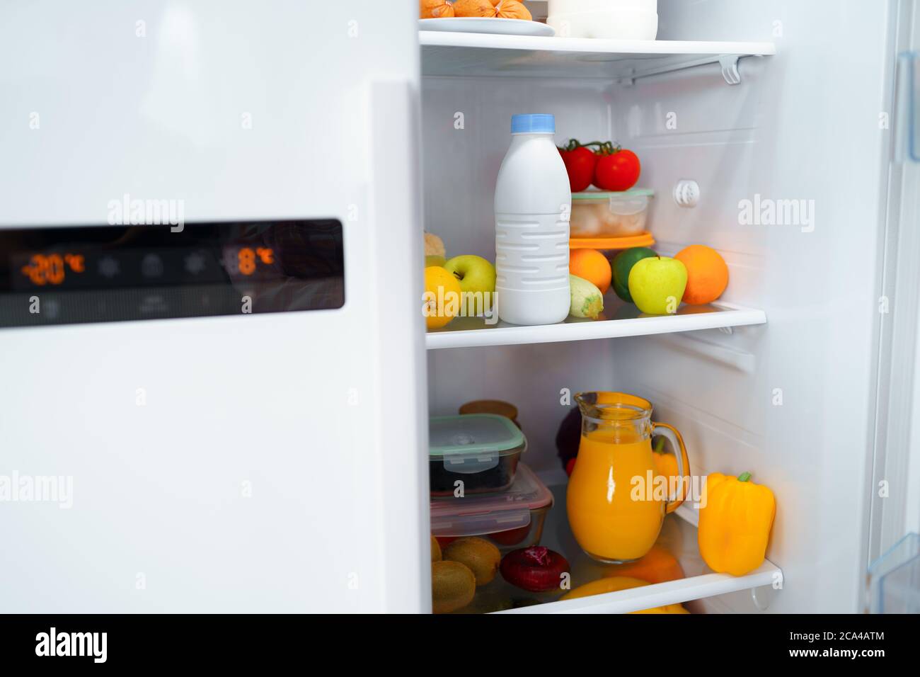 Open fridge with fresh food and drinks Stock Photo - Alamy