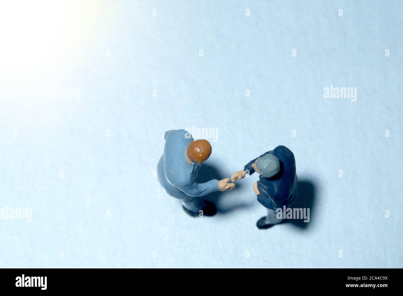 Top view of two businessmen make an handshake partnership agreement ...