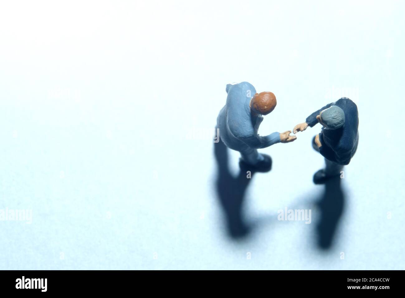 Top view of two businessmen make an handshake partnership agreement ...