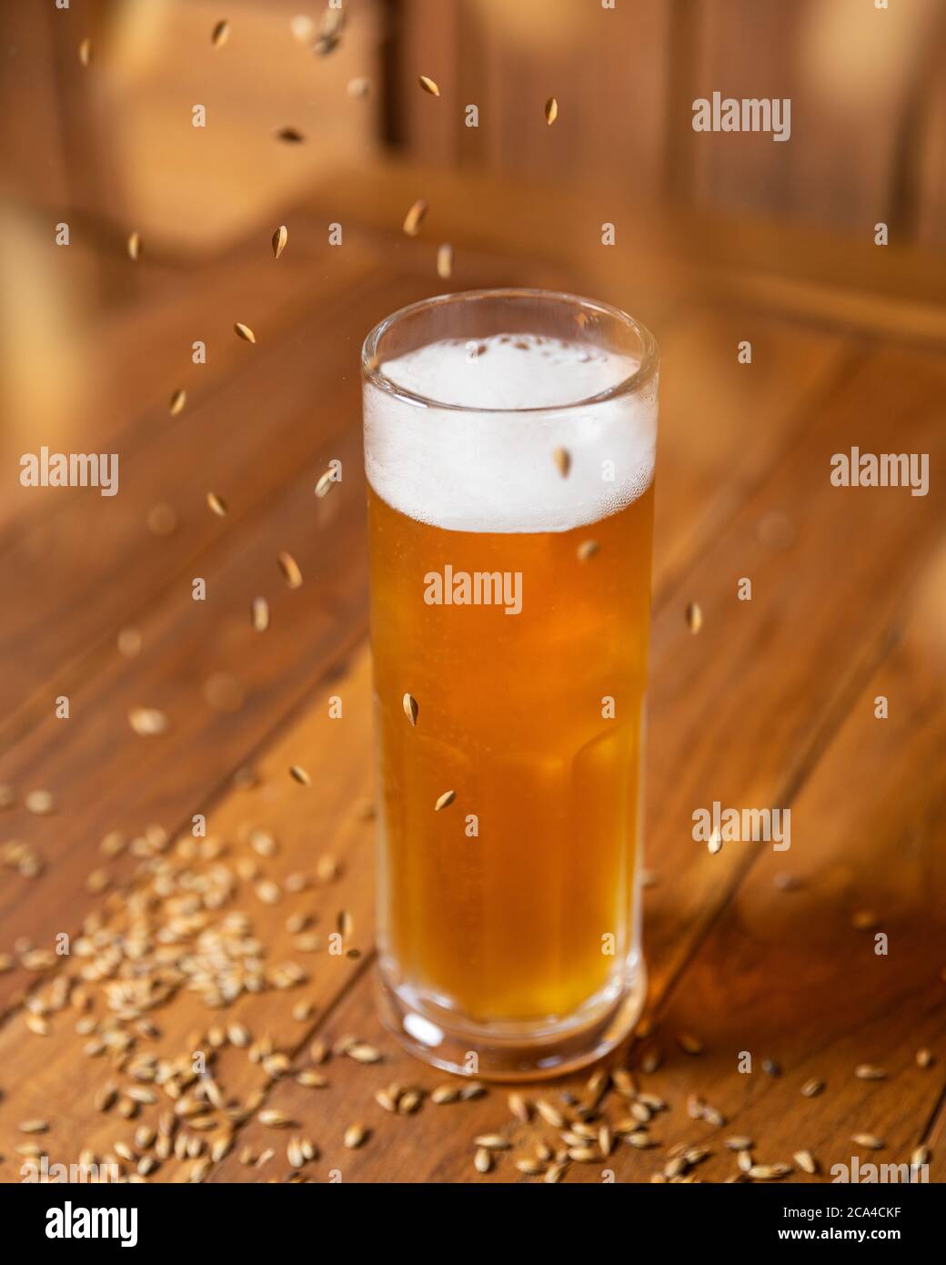 Beer mug, glass with flying malted barley Stock Photo - Alamy