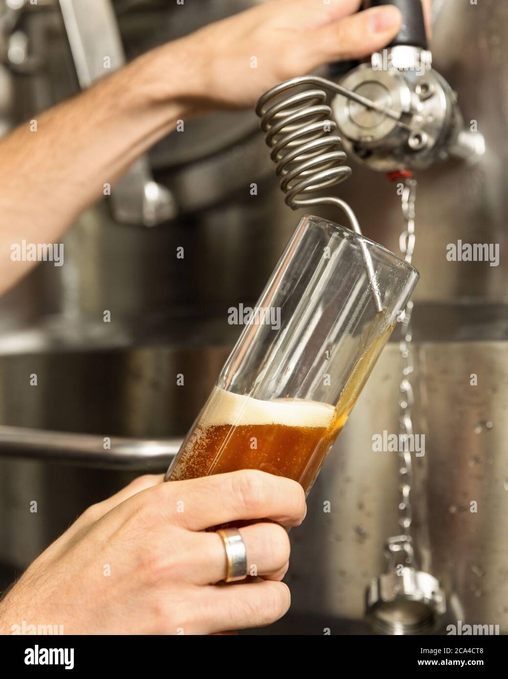 Man pouring, filling beer glass, mug from barrel Stock Photo - Alamy