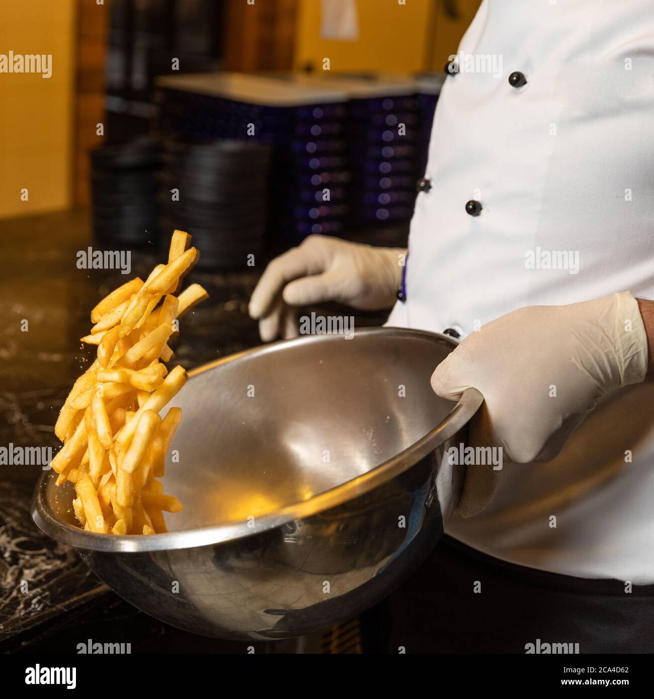 Chef cooking french fries close up Stock Photo - Alamy