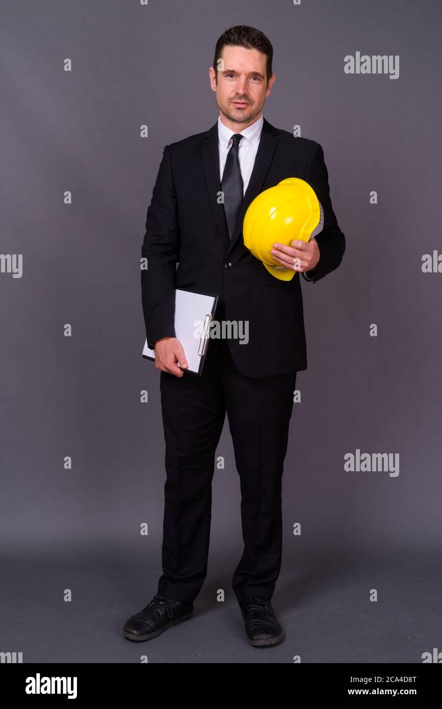 Portrait of handsome bearded businessman as engineer Stock Photo - Alamy