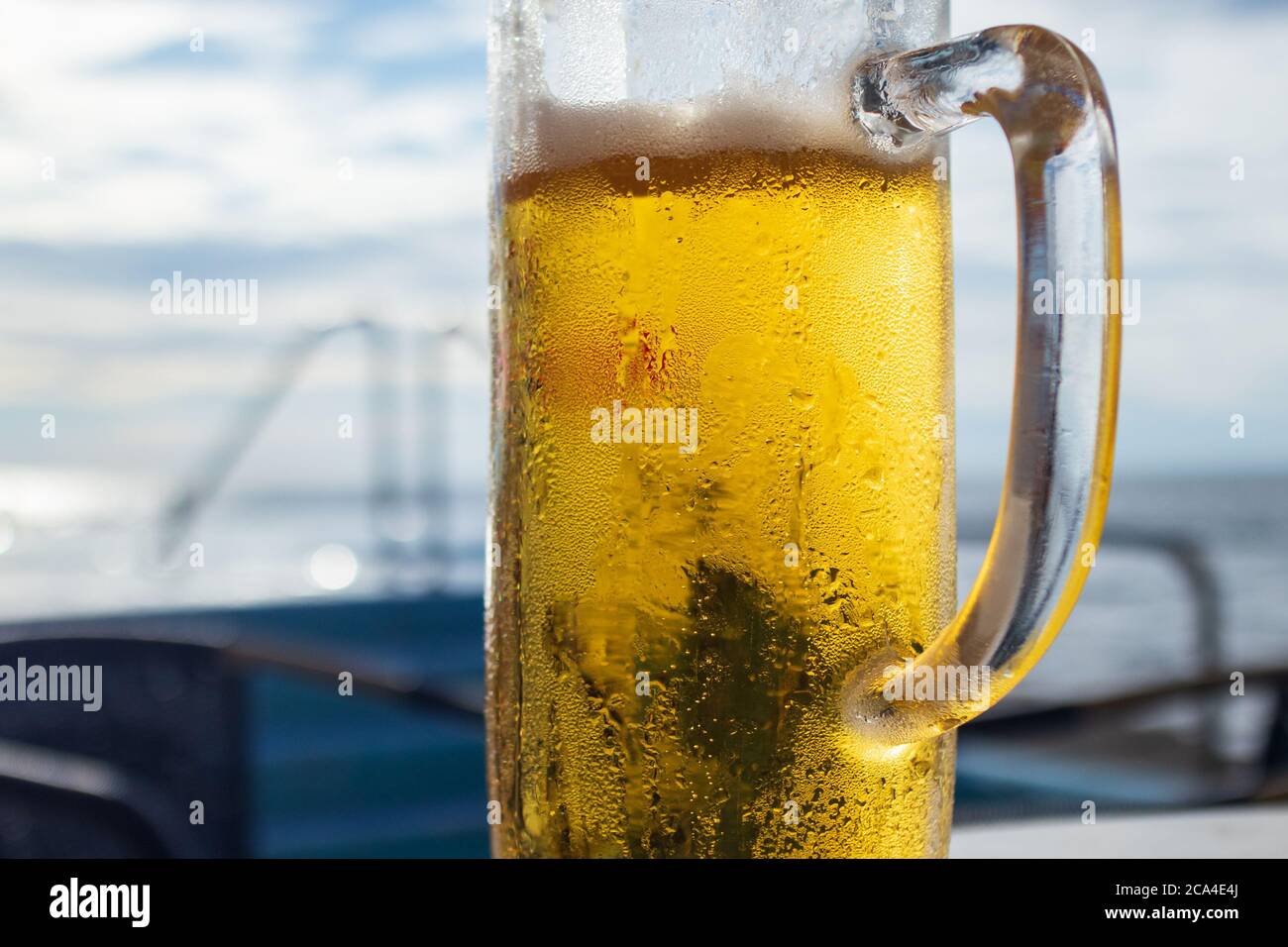 Cold Beer on a beach in big glass Stock Photo - Alamy