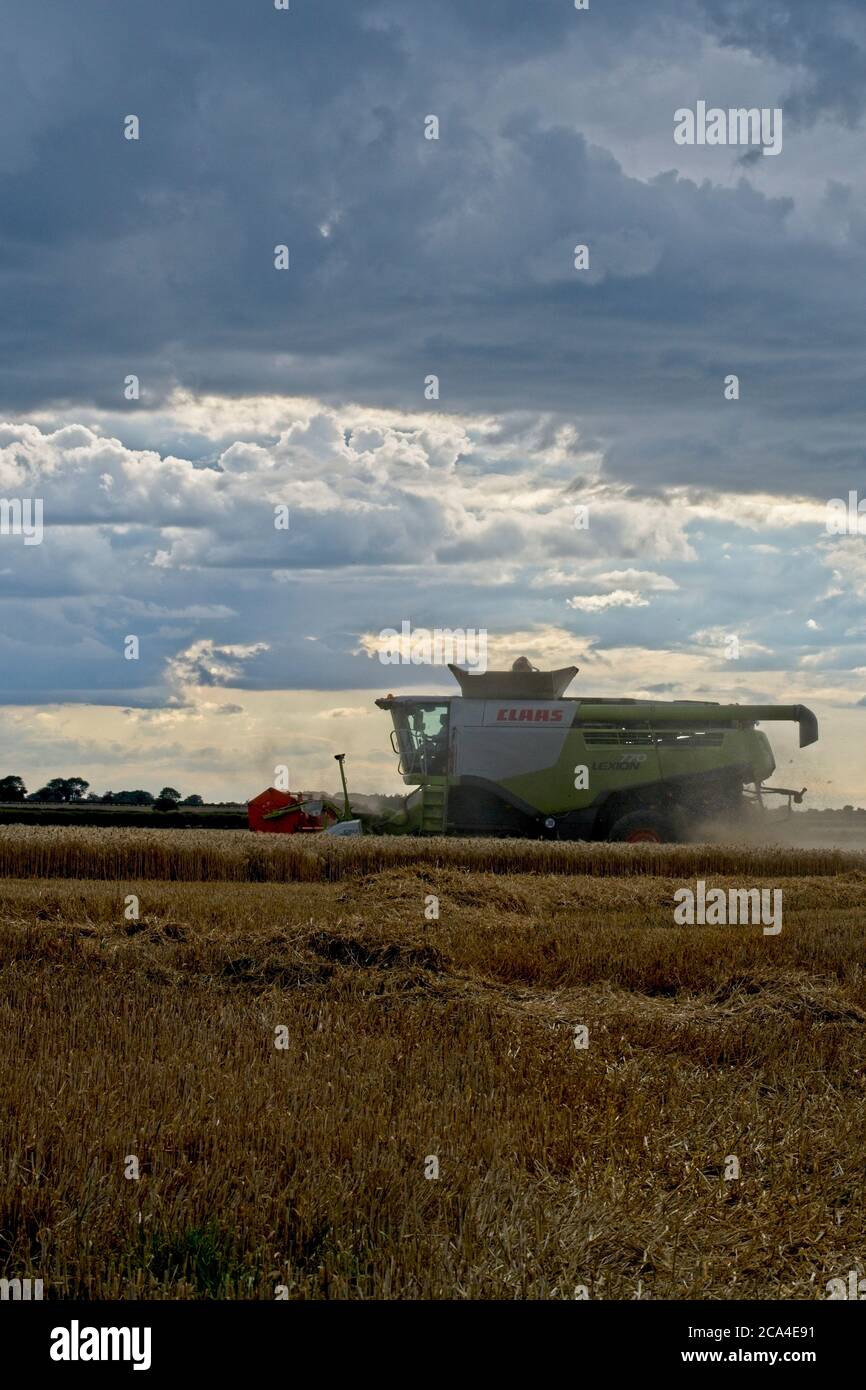 Side view modern combine gathering hi-res stock photography and images ...