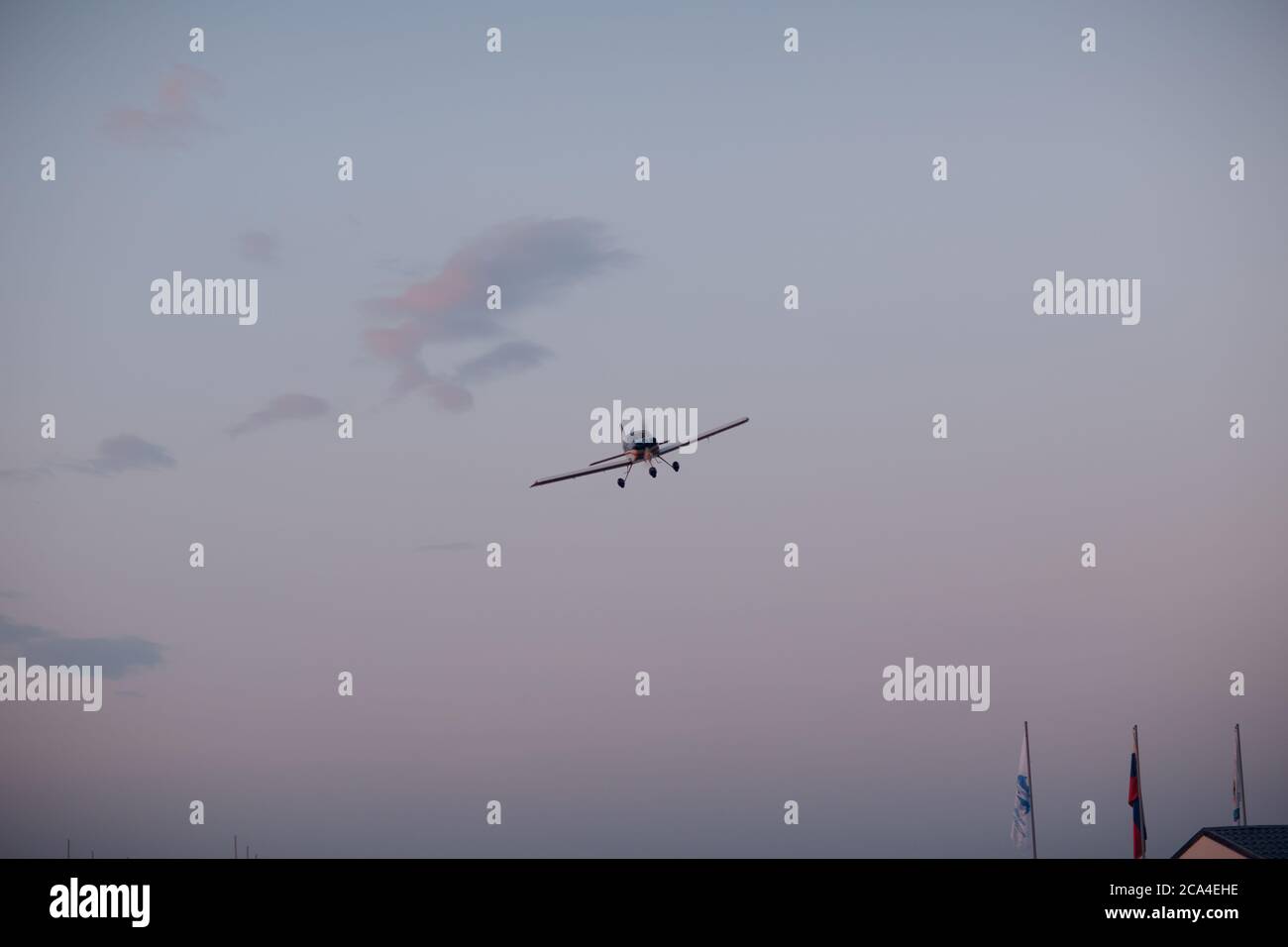 Small single engine airplane flying against sunset sky Stock Photo - Alamy