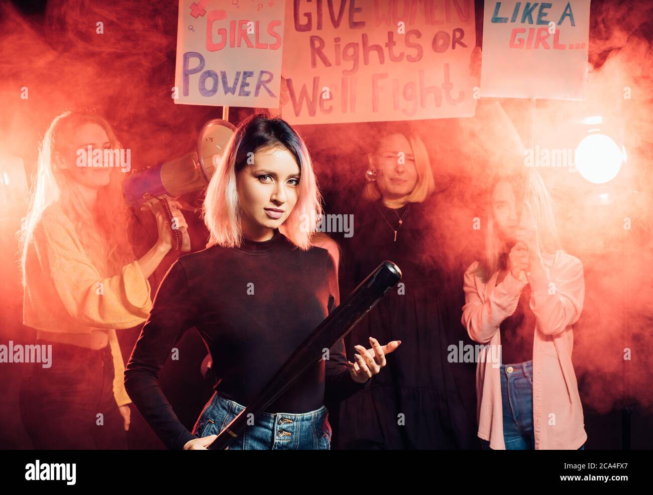 beautiful feminist girl stand holding bat expressing feminism movement ...