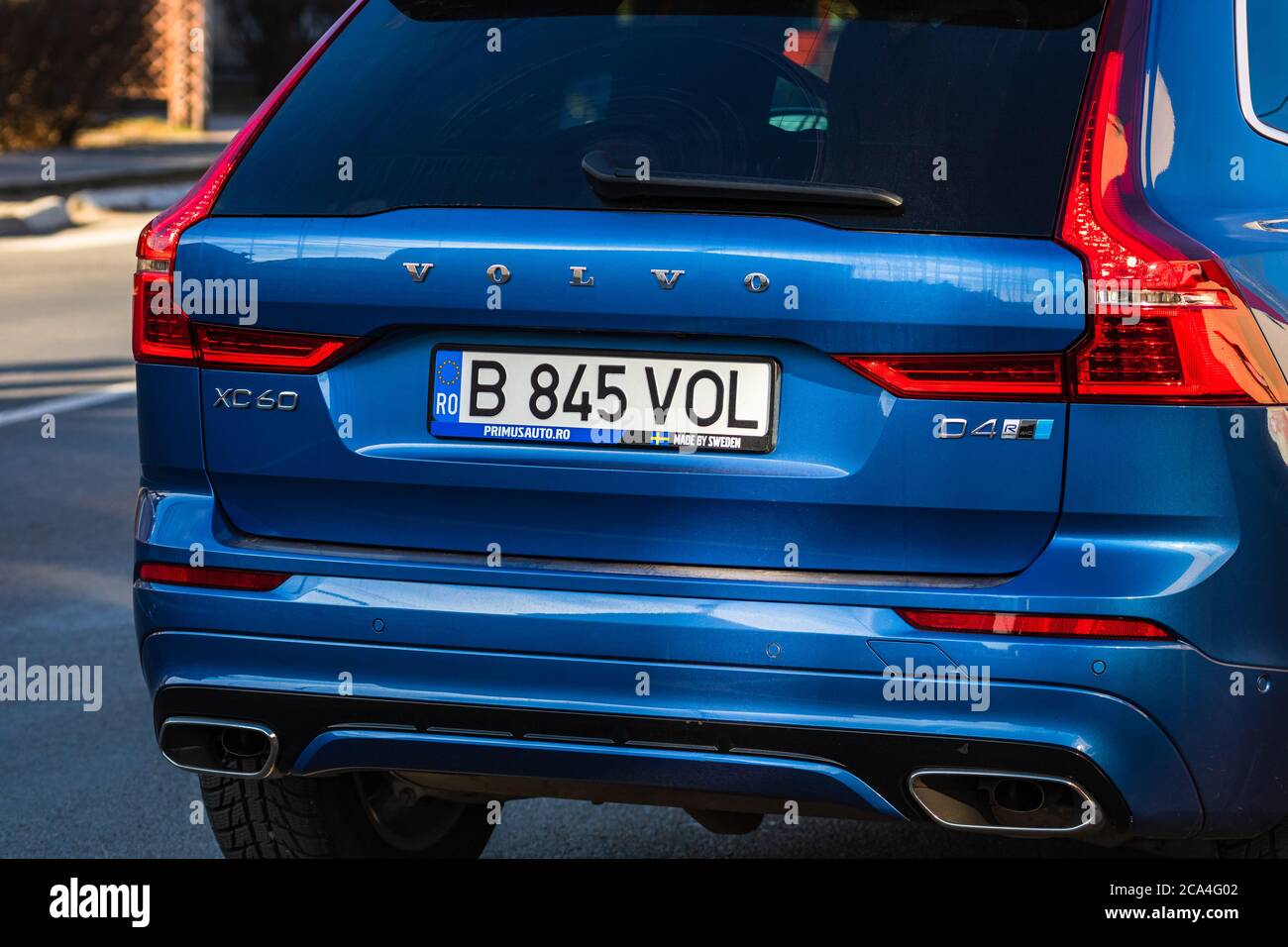 Back view of a blue luxury family car Volvo XC60 on a street in ...