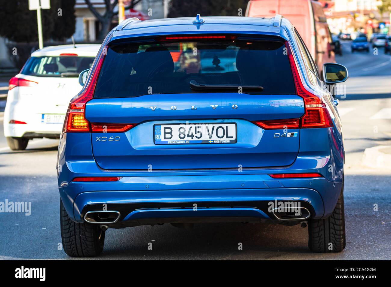 Back view of a blue luxury family car Volvo XC60 on a street in ...
