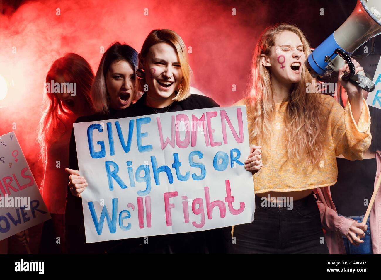young emotional feminists women stand together promoting feminism ...