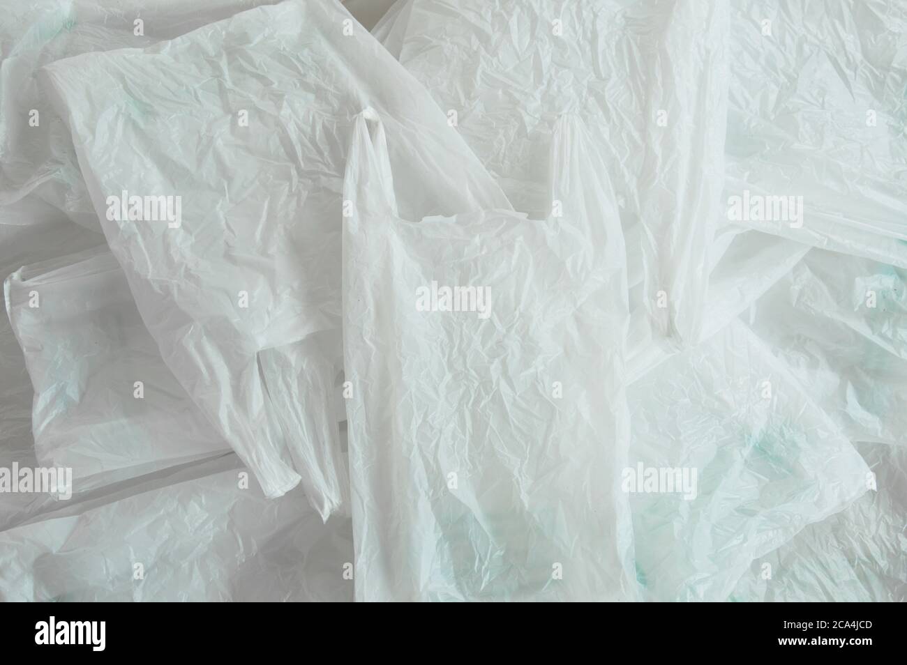 white plastic bag packing stacking on floor Stock Photo - Alamy