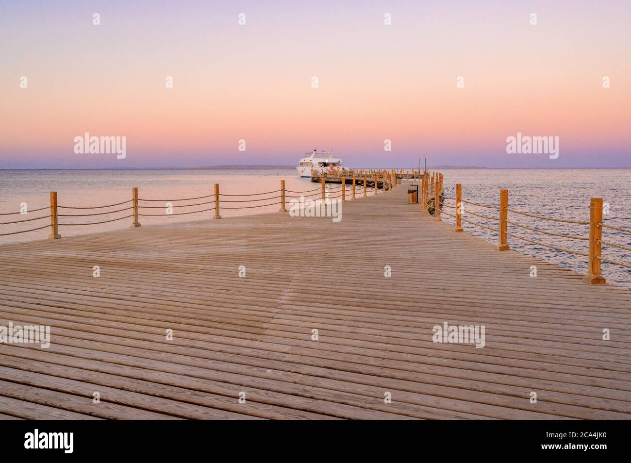 Wooden Pier on Red Sea in Hurghada at sunset and luxury yacht, View of ...