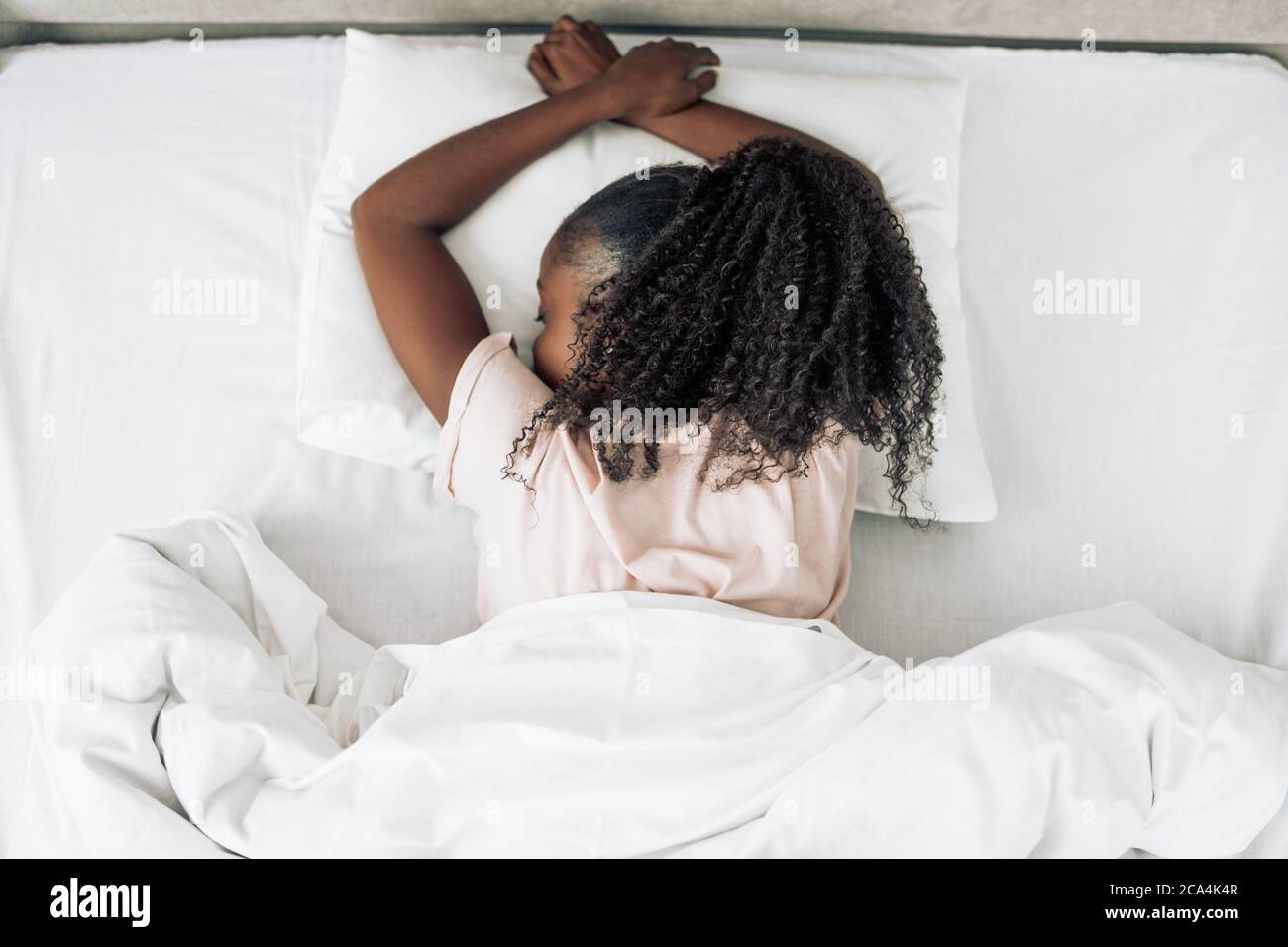 tired girl is sleeping on her stomach . comfortable pose for sleeping ...