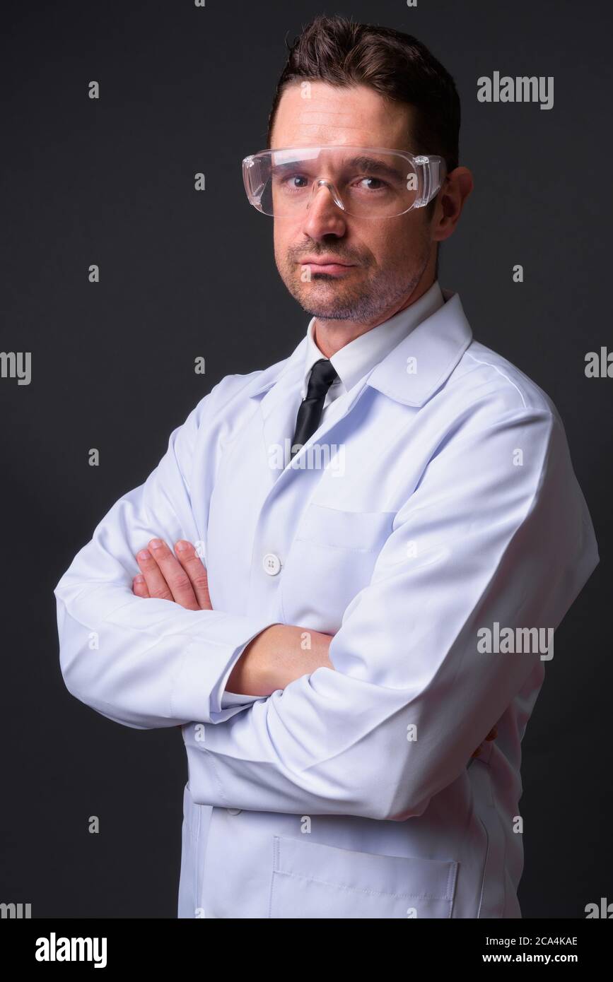 Portrait of handsome bearded man doctor as scientist Stock Photo - Alamy