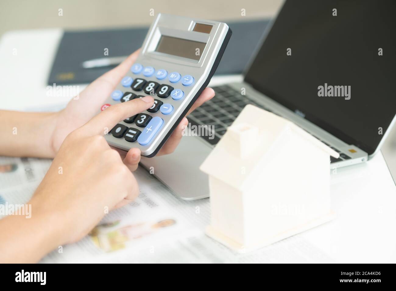 Banker calculator hi-res stock photography and images - Alamy