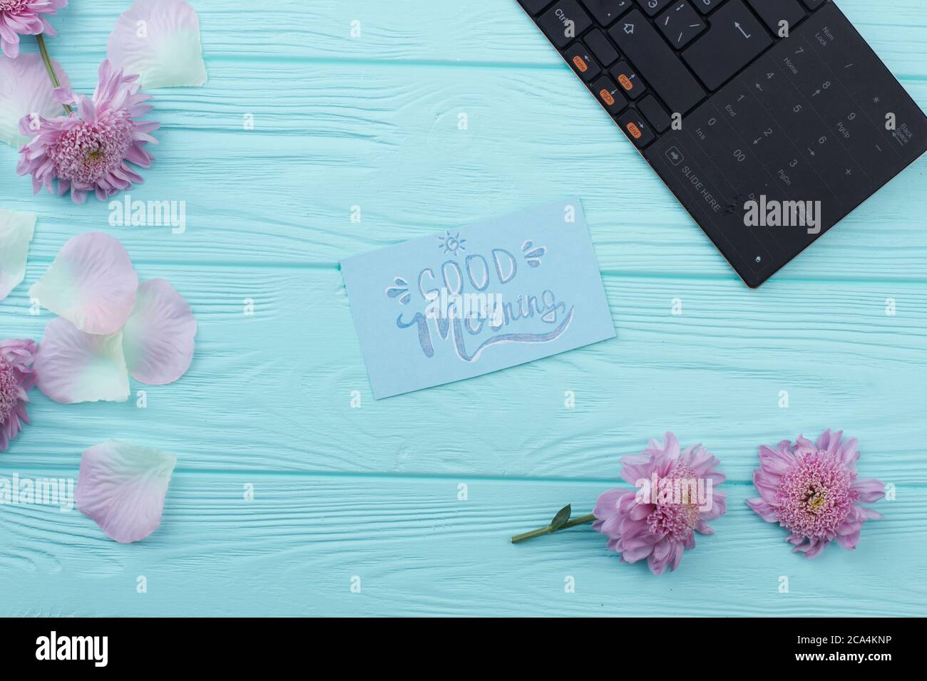Good morning wish with flowers and pc keyboard Stock Photo - Alamy