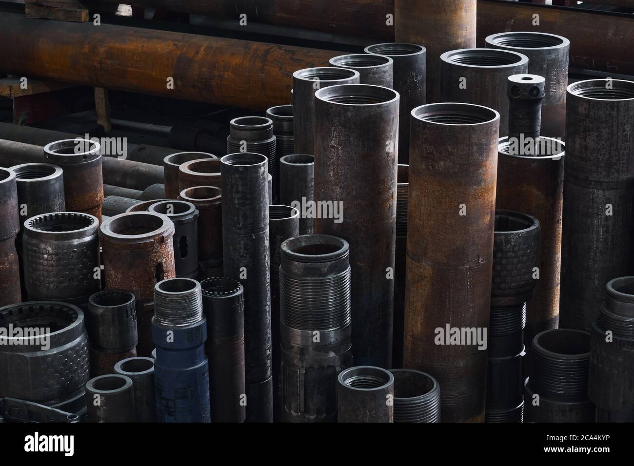 industrial background - rusty hardware, parts of turbodrills of various ...