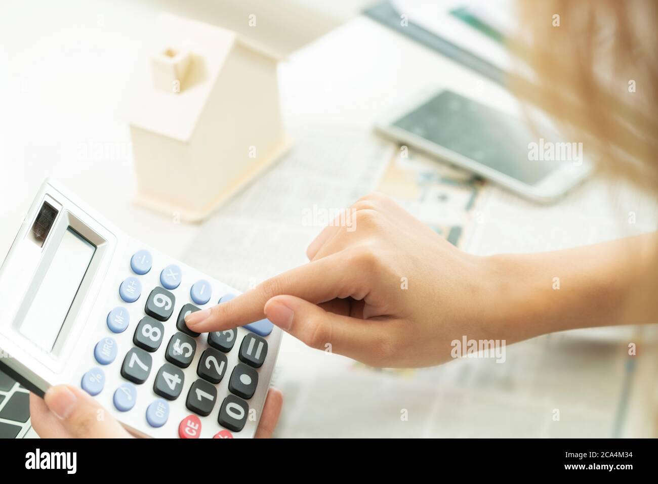 Banker calculator hi-res stock photography and images - Alamy