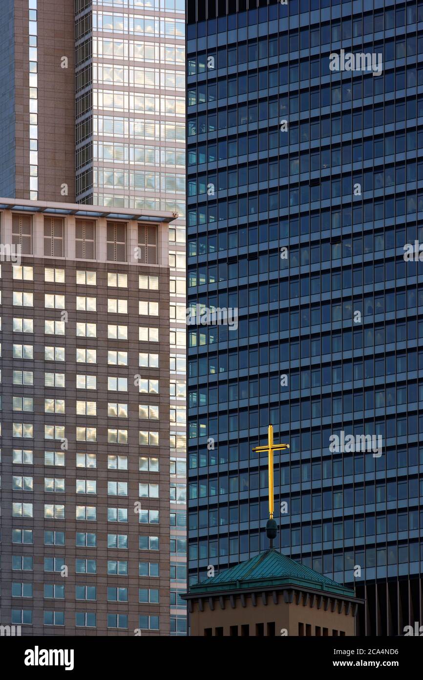 Christian cross on church, Skyscrapers in the back Stock Photo - Alamy