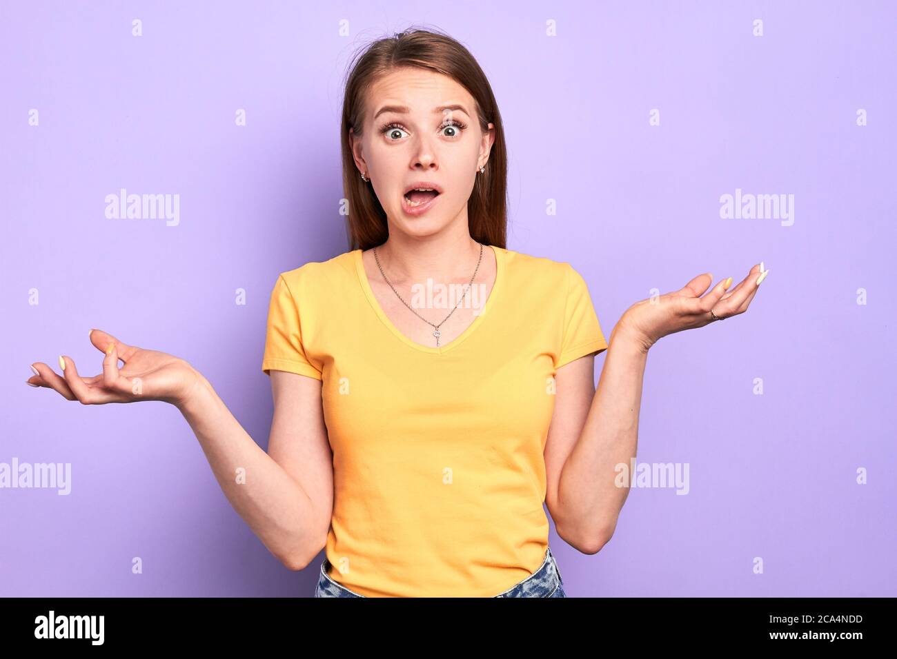 Stunned young female has clueless and puzzled face expression, doesnt ...