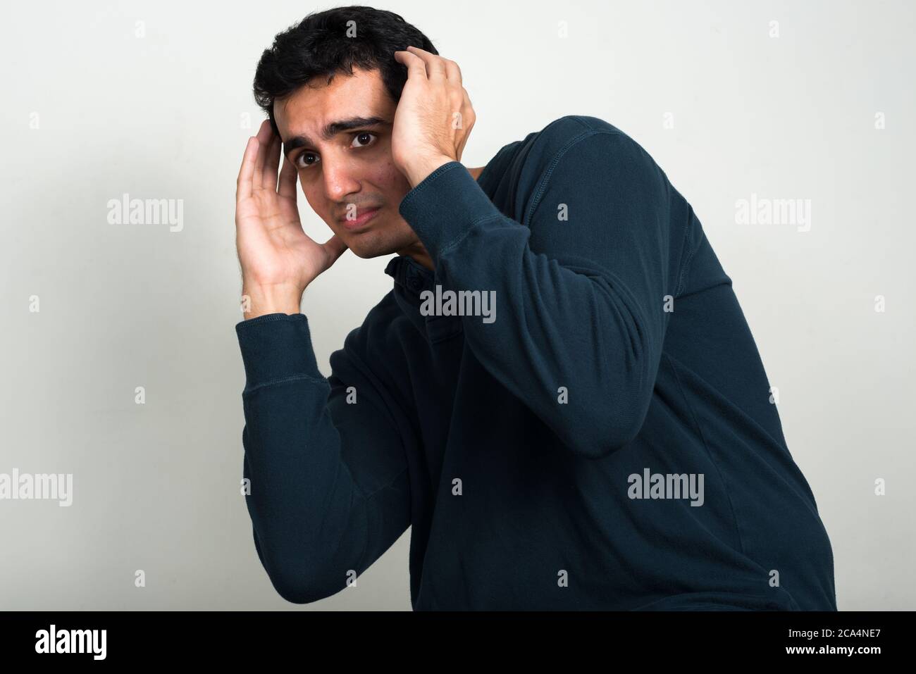 Portrait of stressed young Indian man looking scared Stock Photo - Alamy