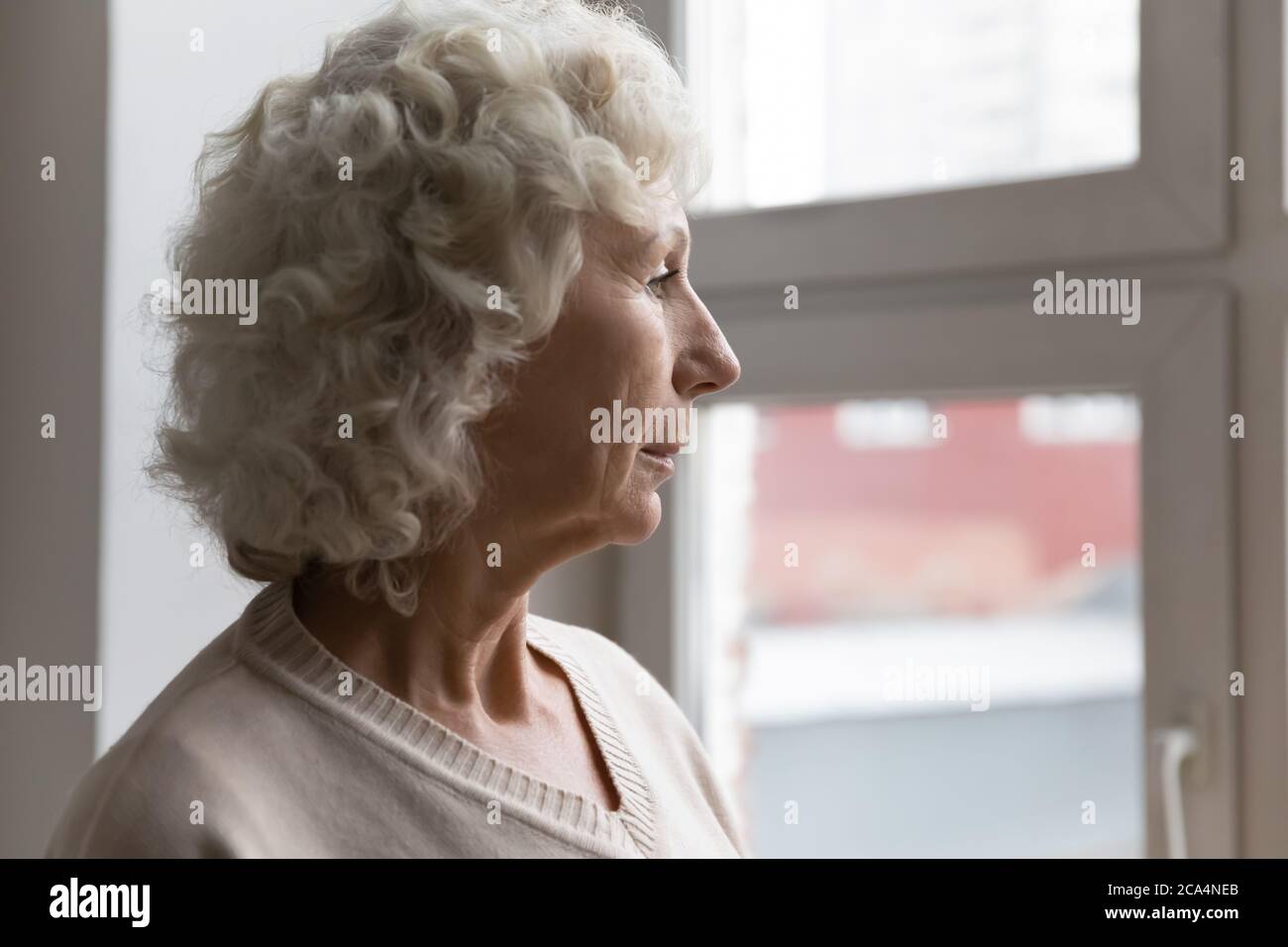 Old woman window dementia hi-res stock photography and images - Alamy