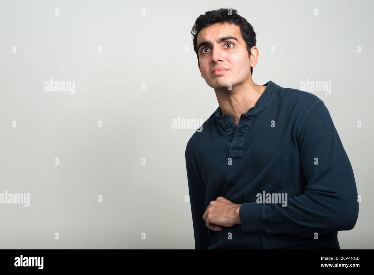 Portrait of stressed young Indian man looking scared Stock Photo - Alamy