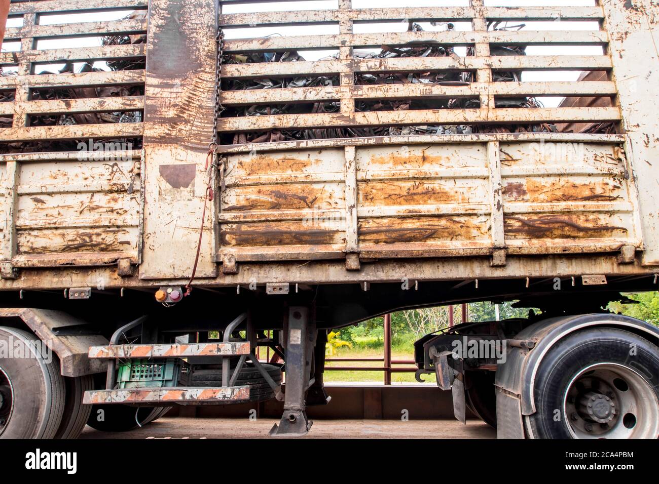 Scrap steel in the rusty steel crate in the truck Stock Photo - Alamy