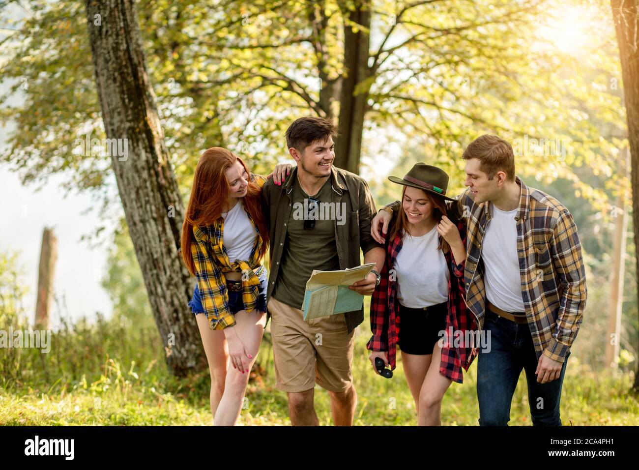 young attractive four people playing game, taking part in the quest ...