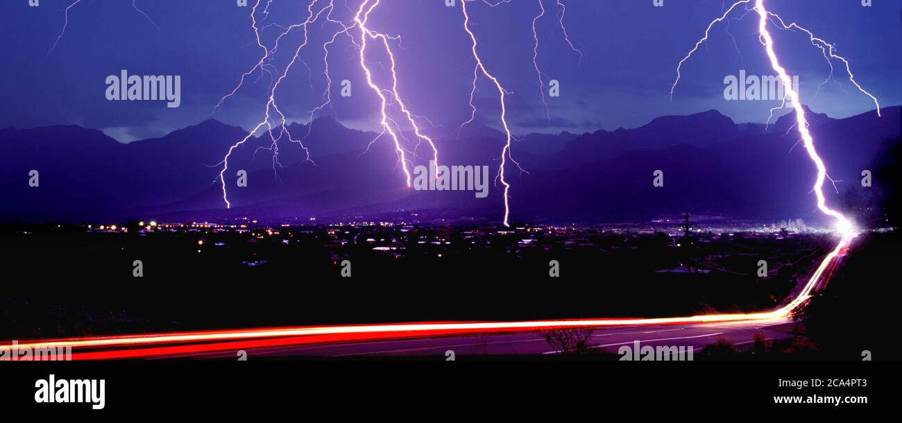 Lightning over a city Stock Photo - Alamy