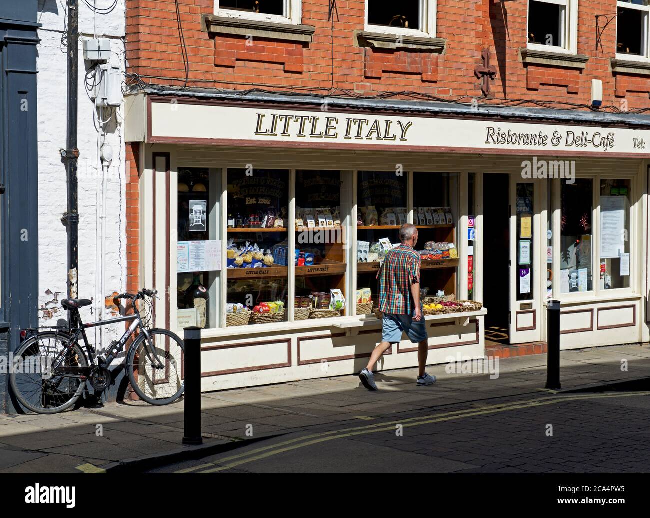 Man walking past Little Italy café, Goodramgate, York, North Yorkshire ...