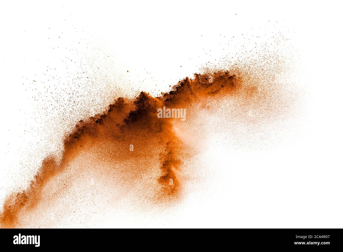 Brown dust exploding cloud.Brown particles splattered on white ...