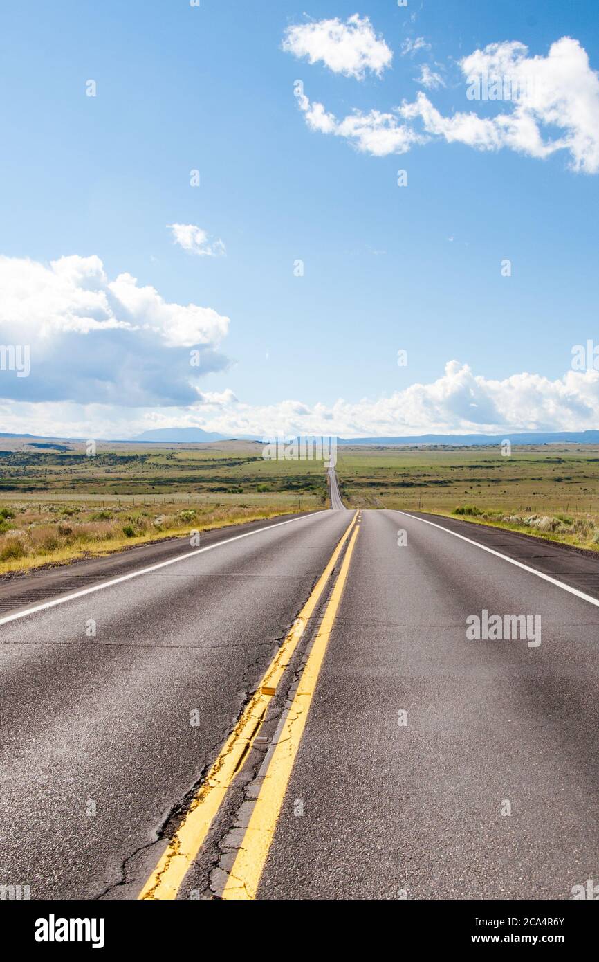 Looking along a long straight road Stock Photo - Alamy