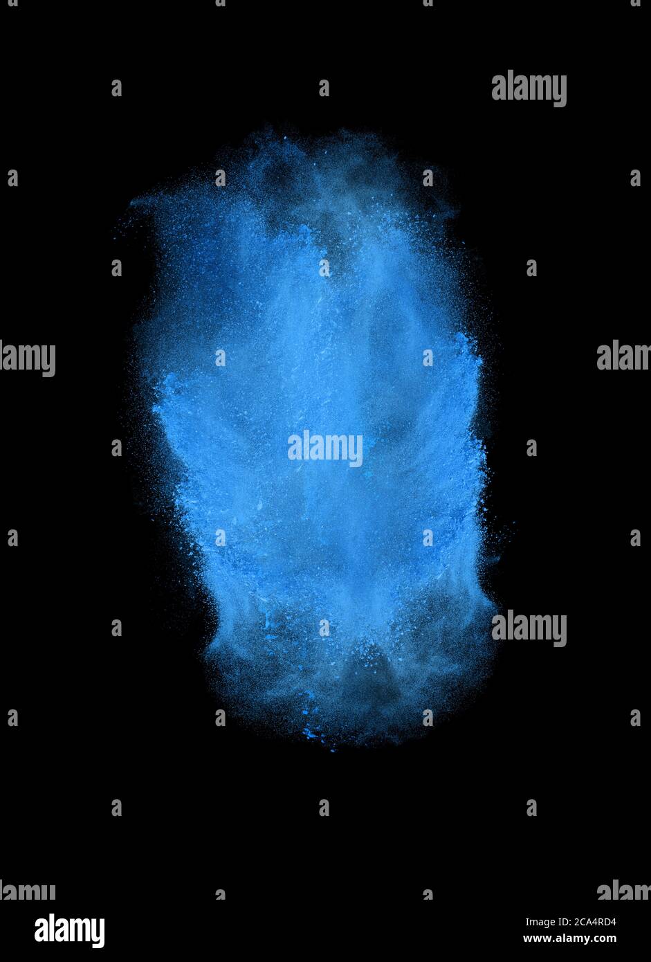 Freeze motion of blue powder exploding, isolated on black. Abstract ...