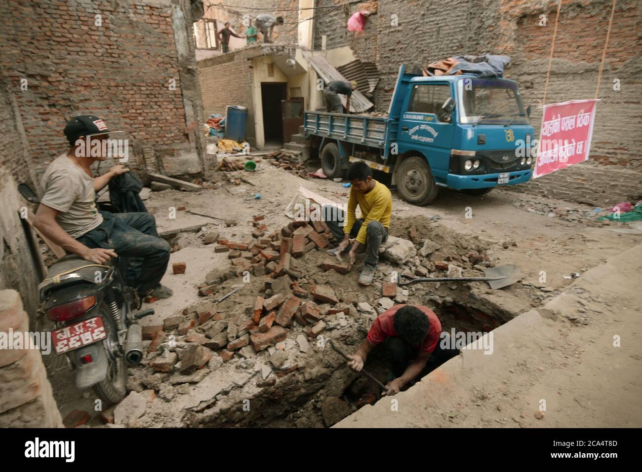 Workers' activity on a streetside building construction project in ...