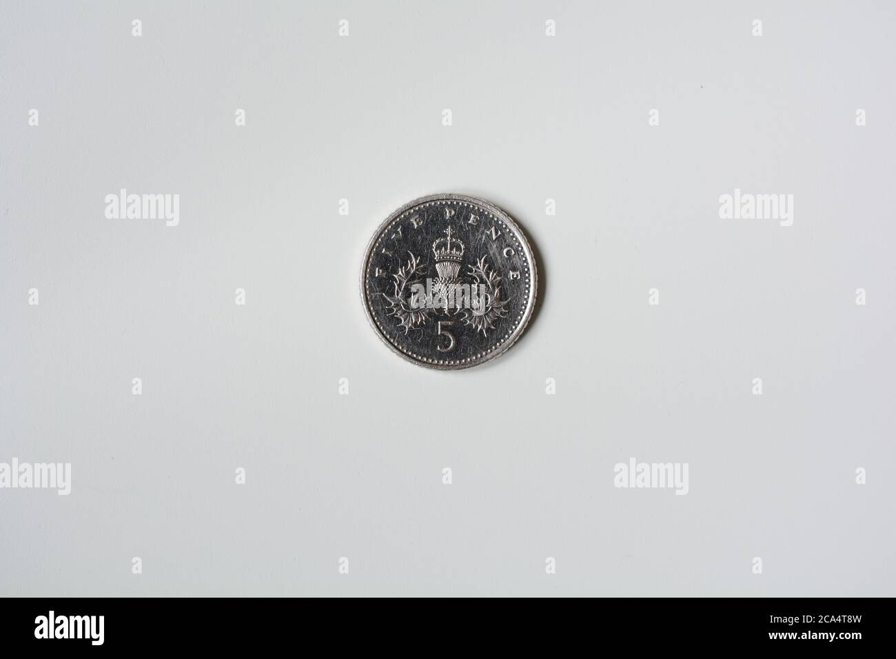 Five pence coin closeup, isolated on white background Stock Photo - Alamy
