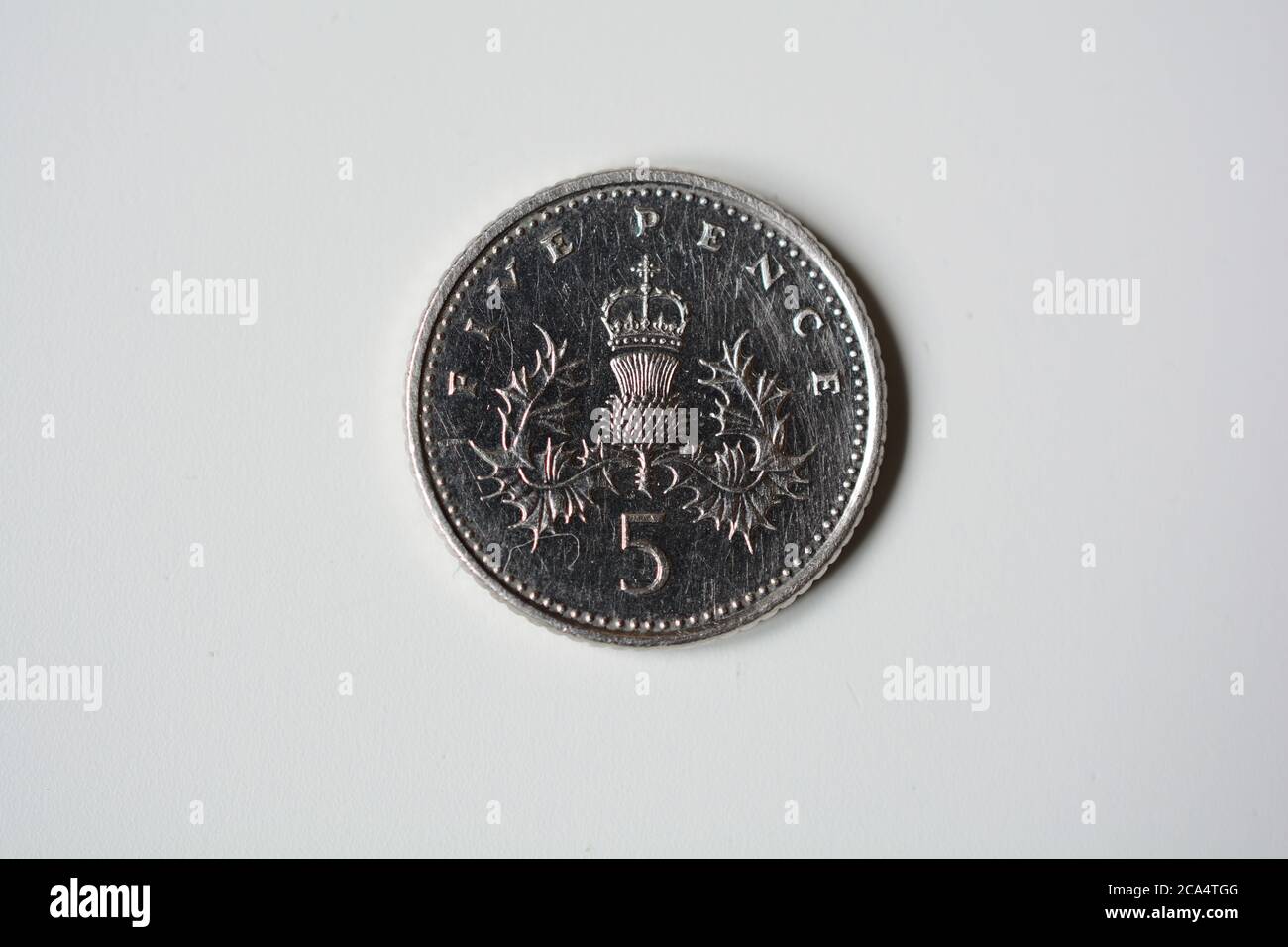 Five pence coin closeup, isolated on white background Stock Photo - Alamy