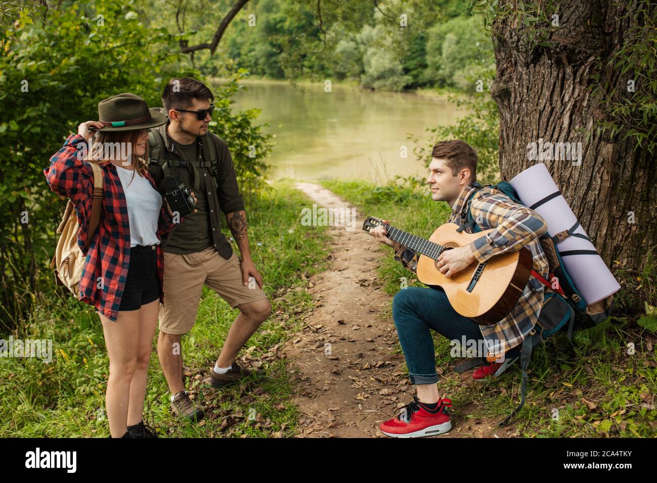 Singing next to tree hi-res stock photography and images - Alamy