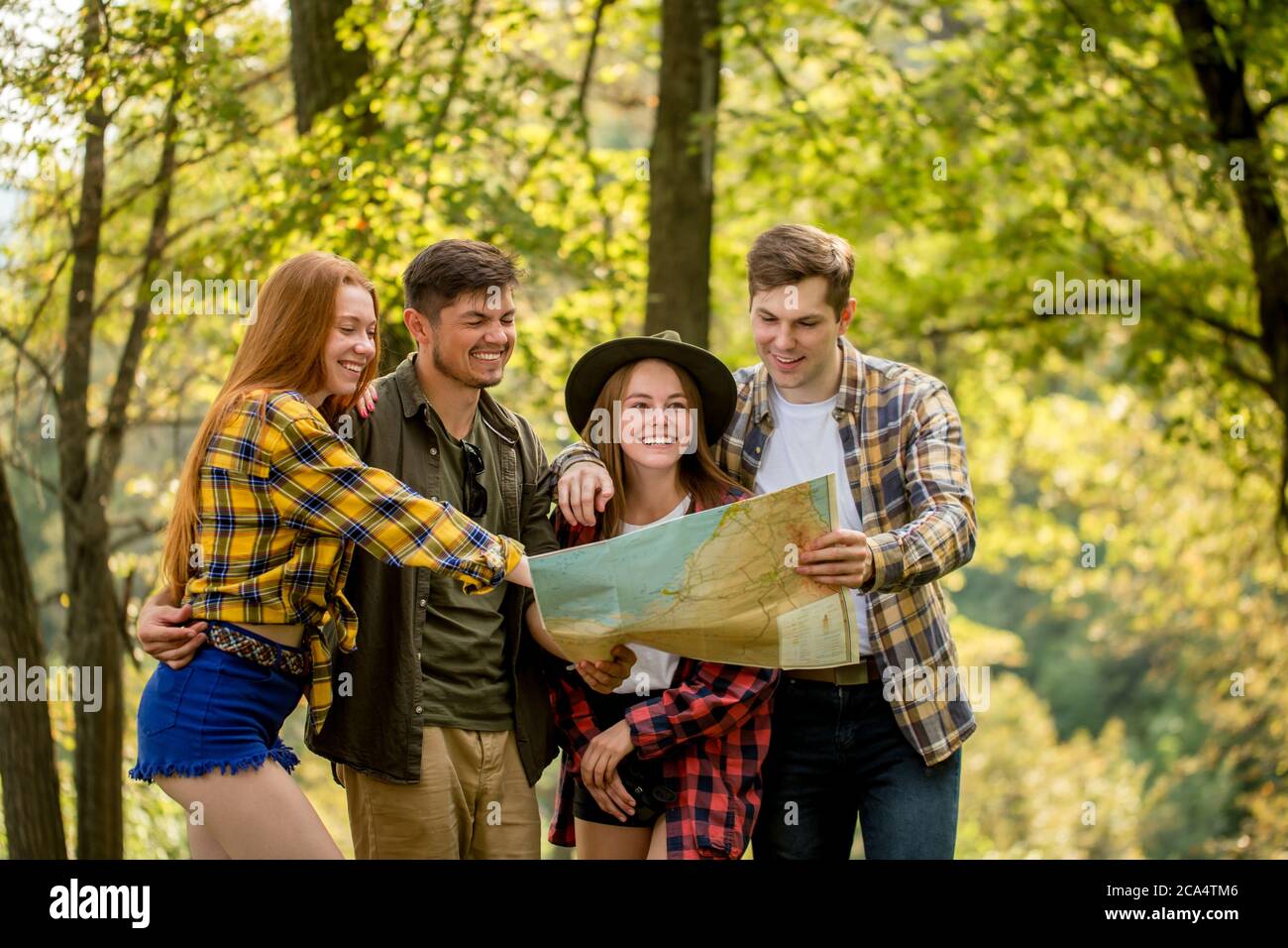 happy active tourists looking for a direction, never give up, young ...