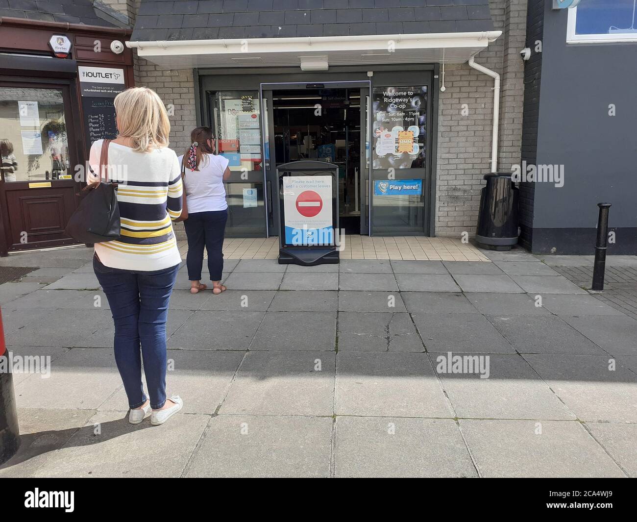 queue of people outside show at height of restrictions waiting to ...