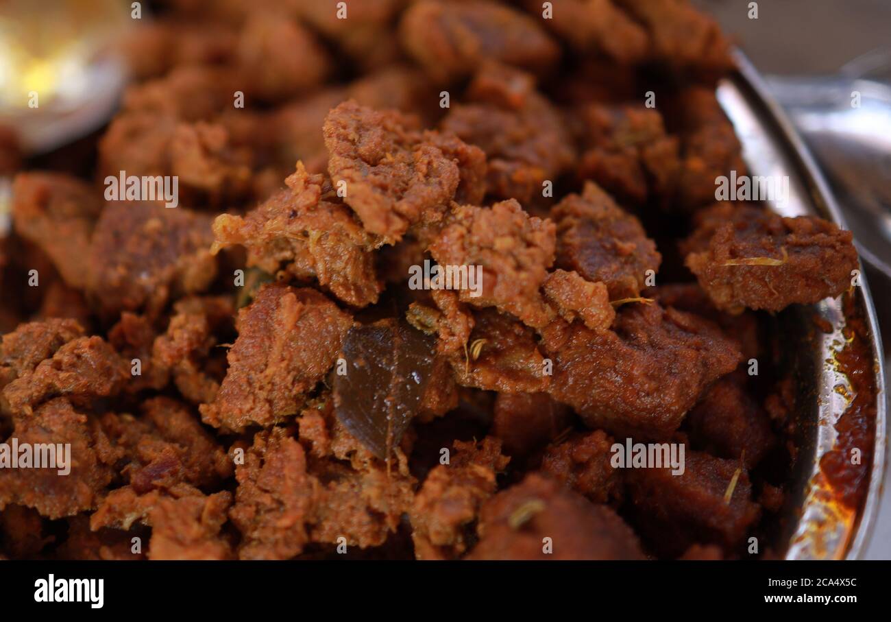 South Indian dish spicy beef fry Kerala, India. side dish ghee rice ...