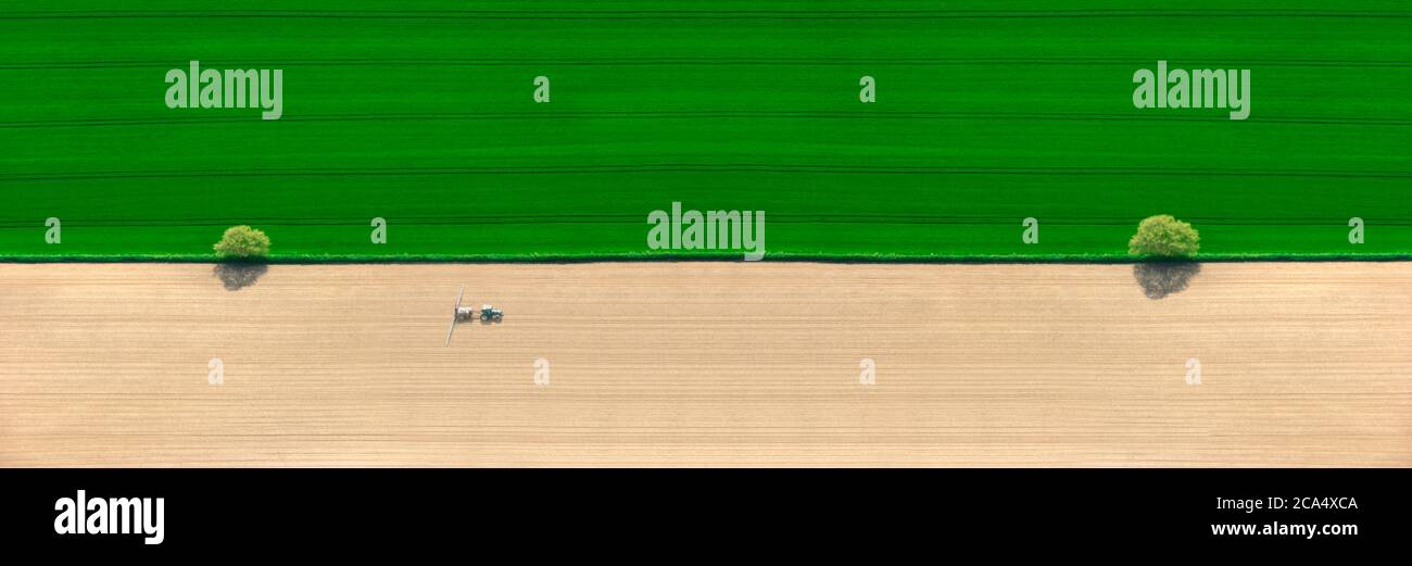 Aerial view of a tractor in field Stock Photo - Alamy