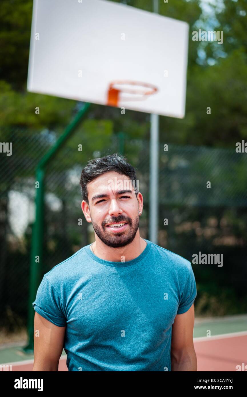 Muscle man playing basketball alone Stock Photo - Alamy