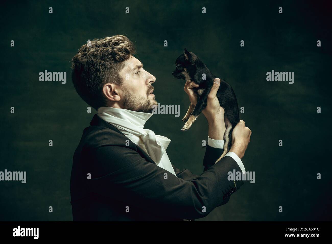 Looking throught years. Young man in suit as Dorian Gray isolated on ...