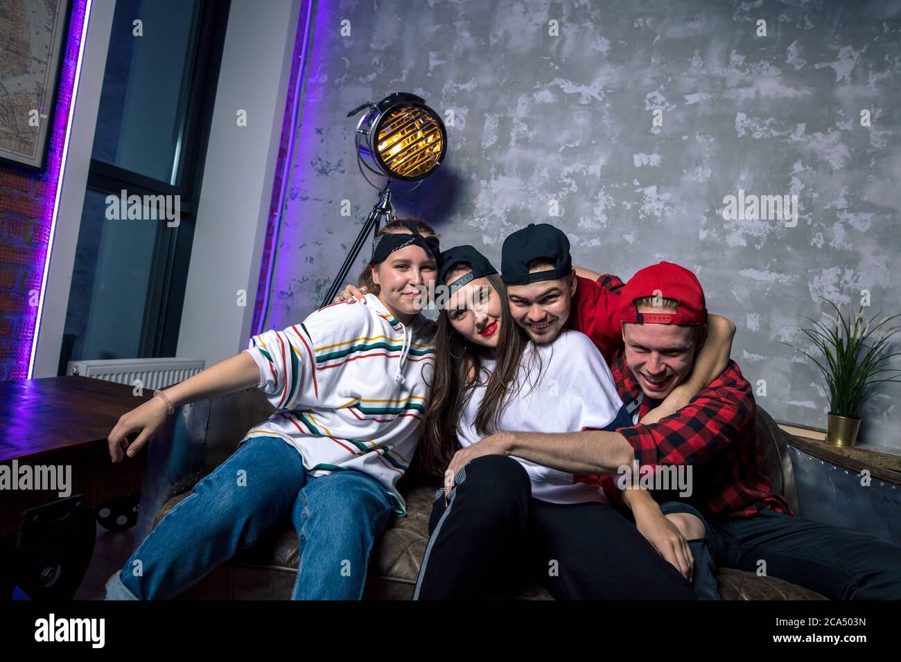 close friends are hugging each other and loooking at the camera. close ...